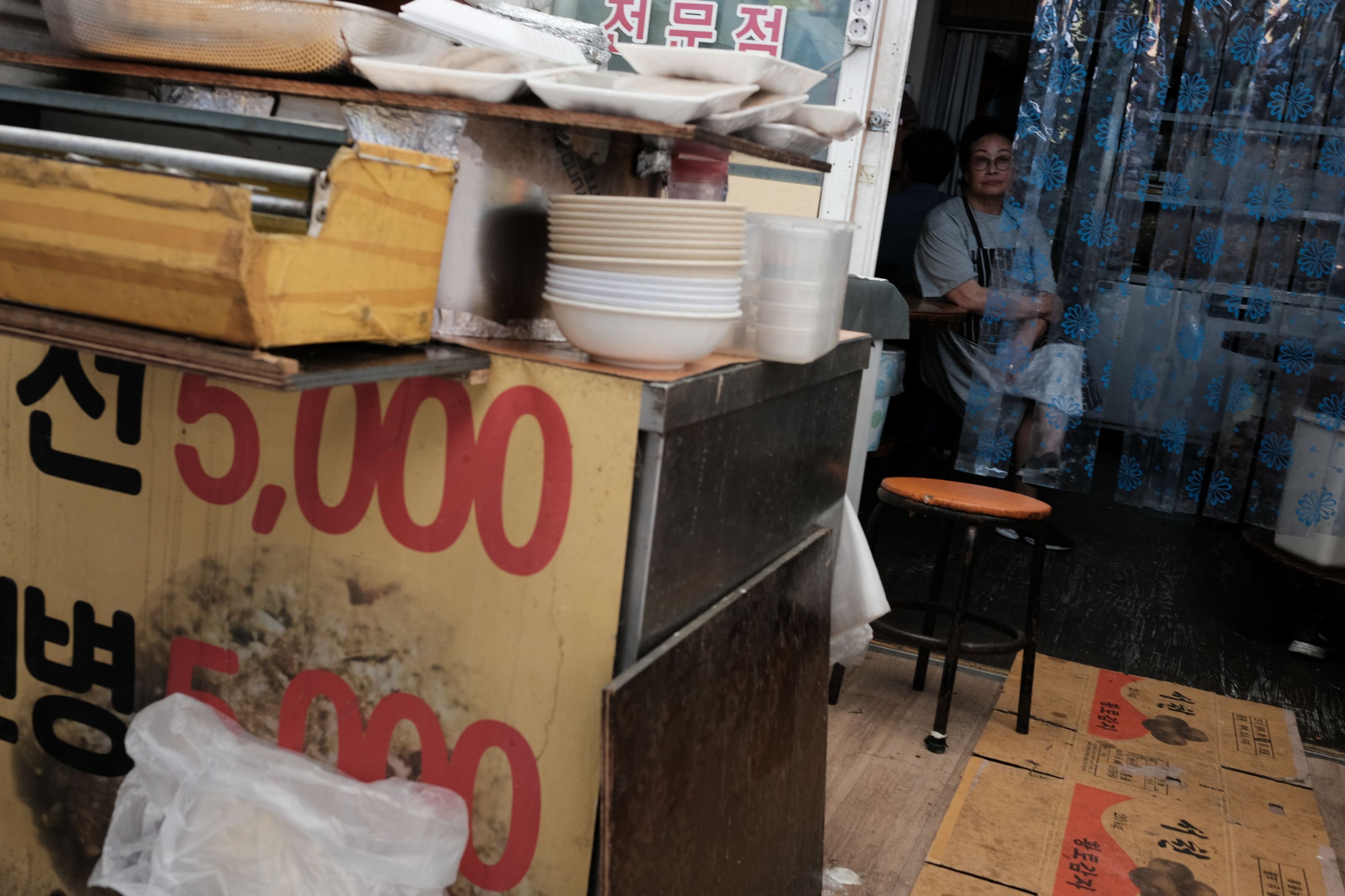 Lady sitting inside restaurant, Chuncheon, South Korea – gsworldphoto