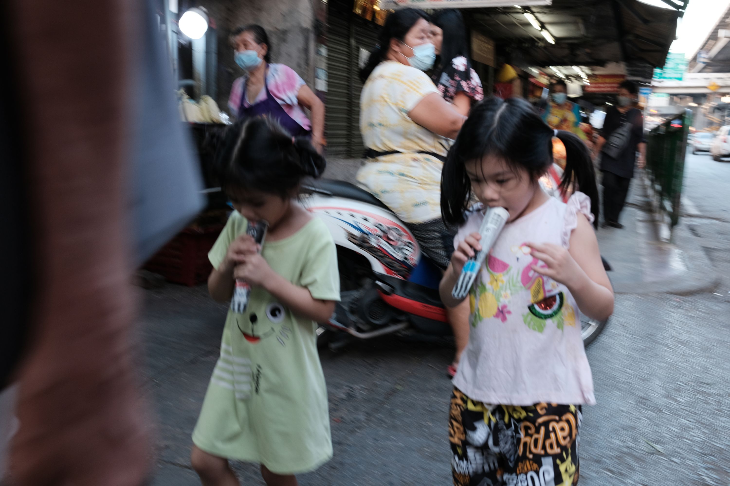 Two girls eating ice pops, Bangkok, Thailand – gsworldphoto