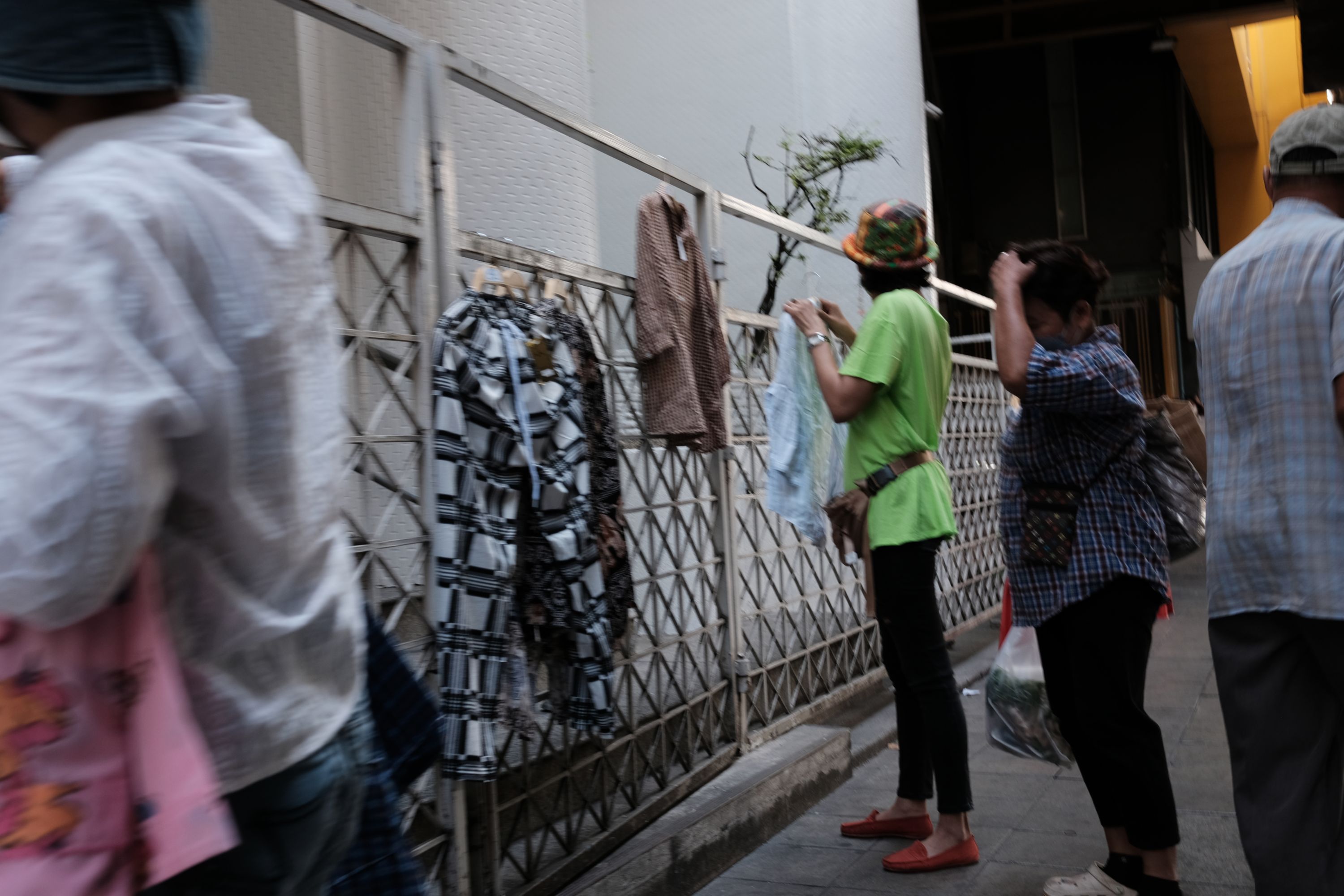 People hanging clothes on fence, Bangkok, Thailand – gsworldphoto