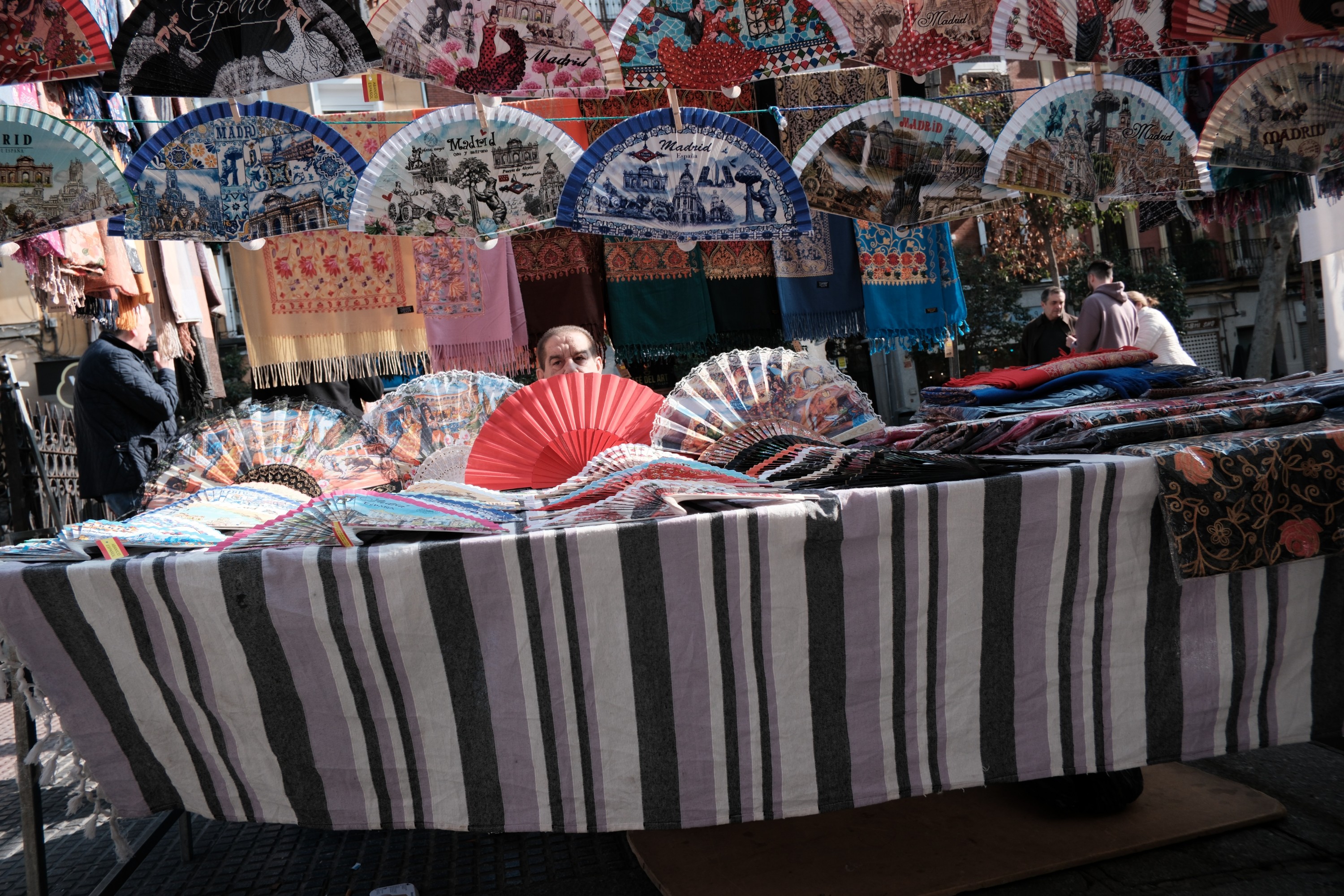 Man behind fans, Madrid, Spain – gsworldphoto